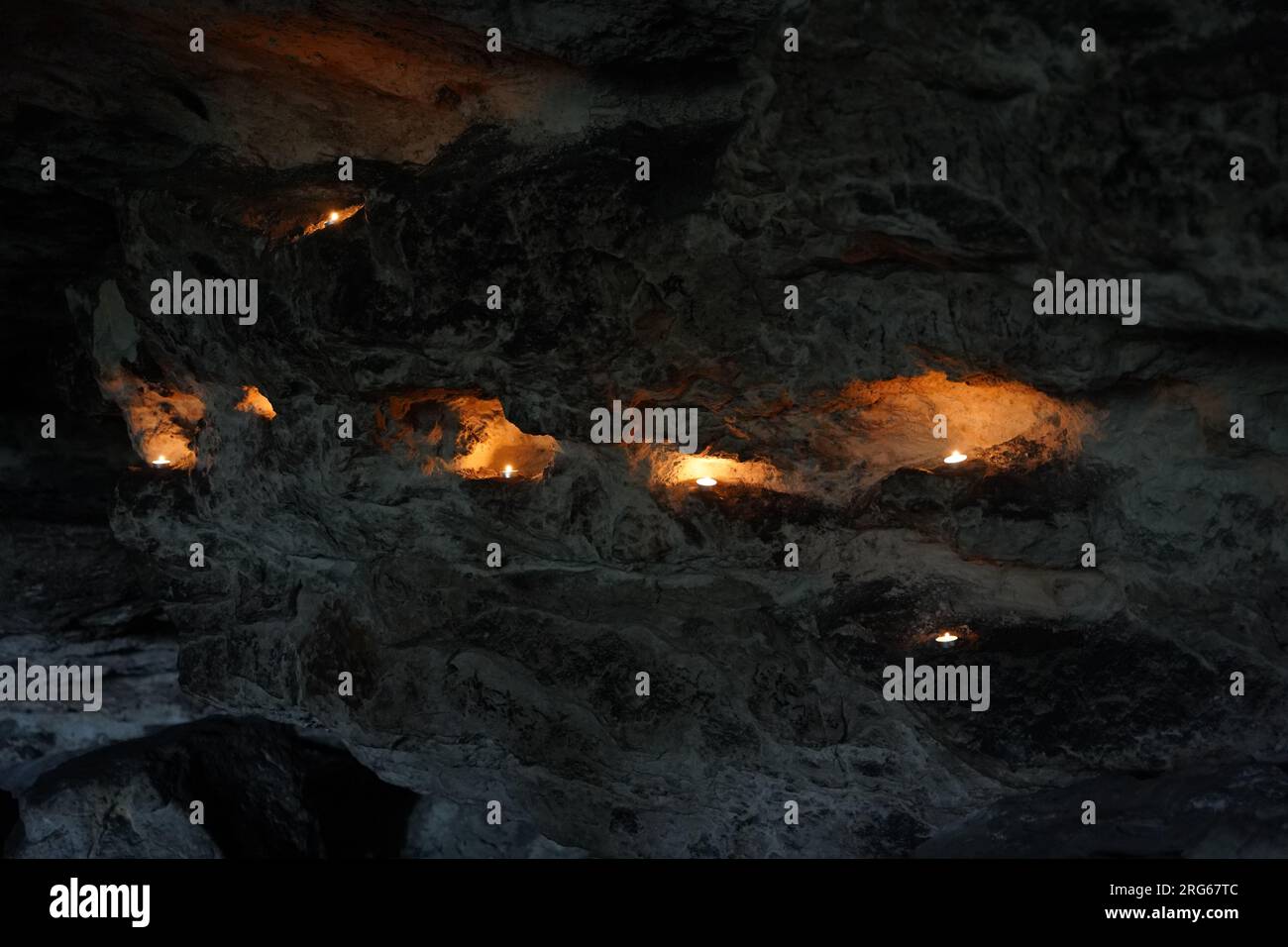 Candles in cave hi-res stock photography and images - Alamy