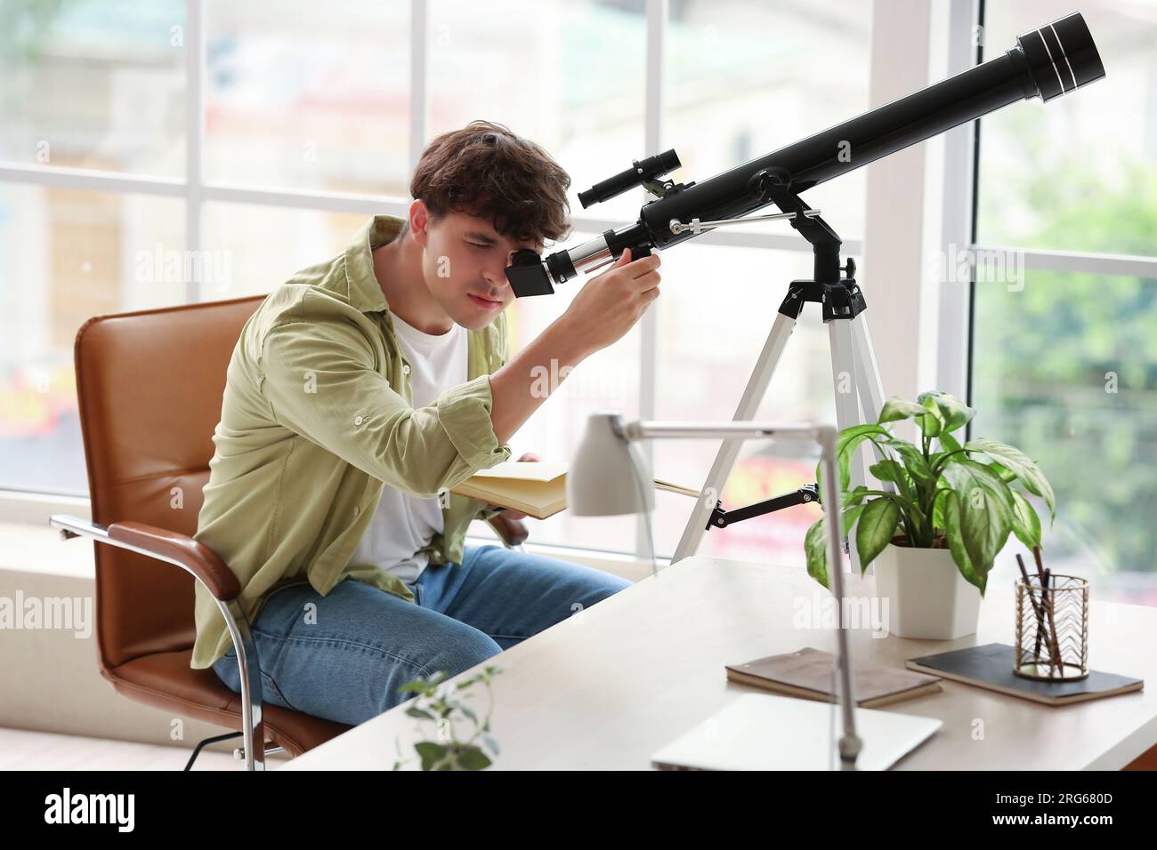 Person using telescope astronomy hi-res stock photography and images ...