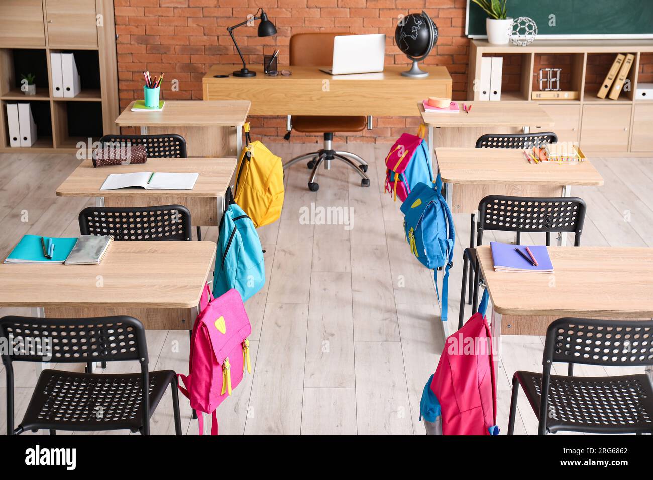 Children backpacks classroom table hi-res stock photography and images ...