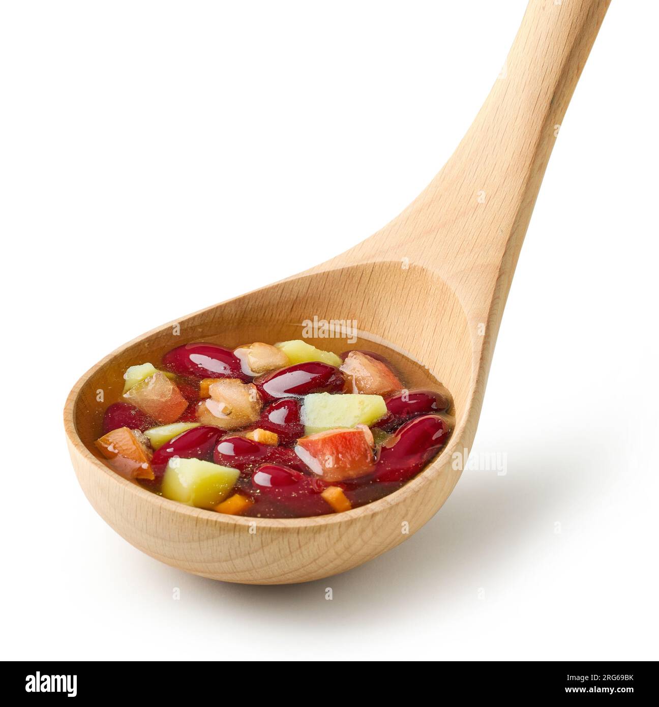 vegetable soup in wooden ladle isolated on white background Stock Photo ...