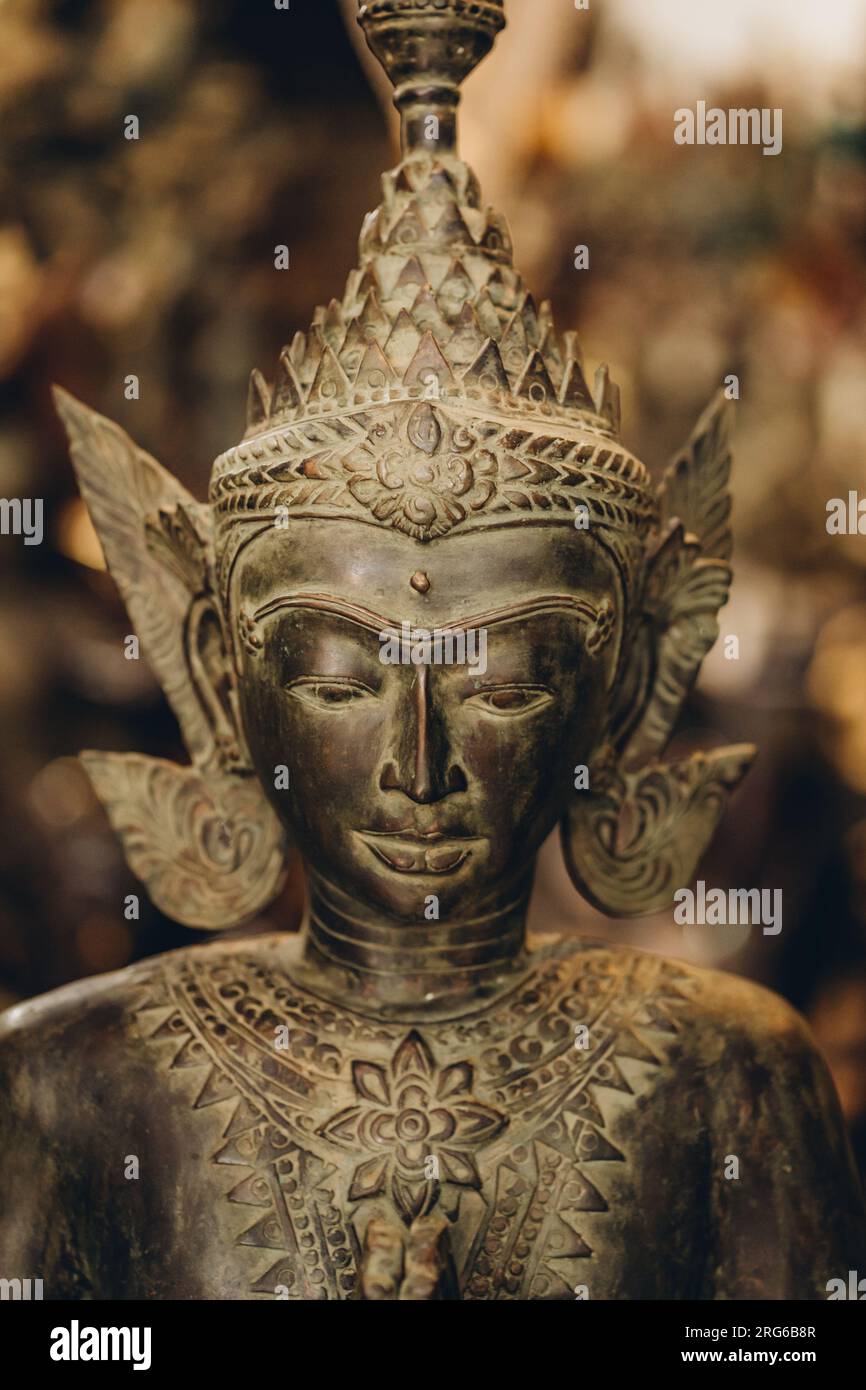 Close up shot of balinese religious bronze statue. Traditional sacred ...