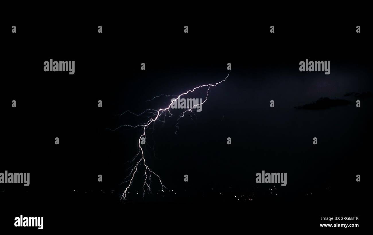 Night stormy sky over city. Beautiful lightning strike. Thundercloud ...