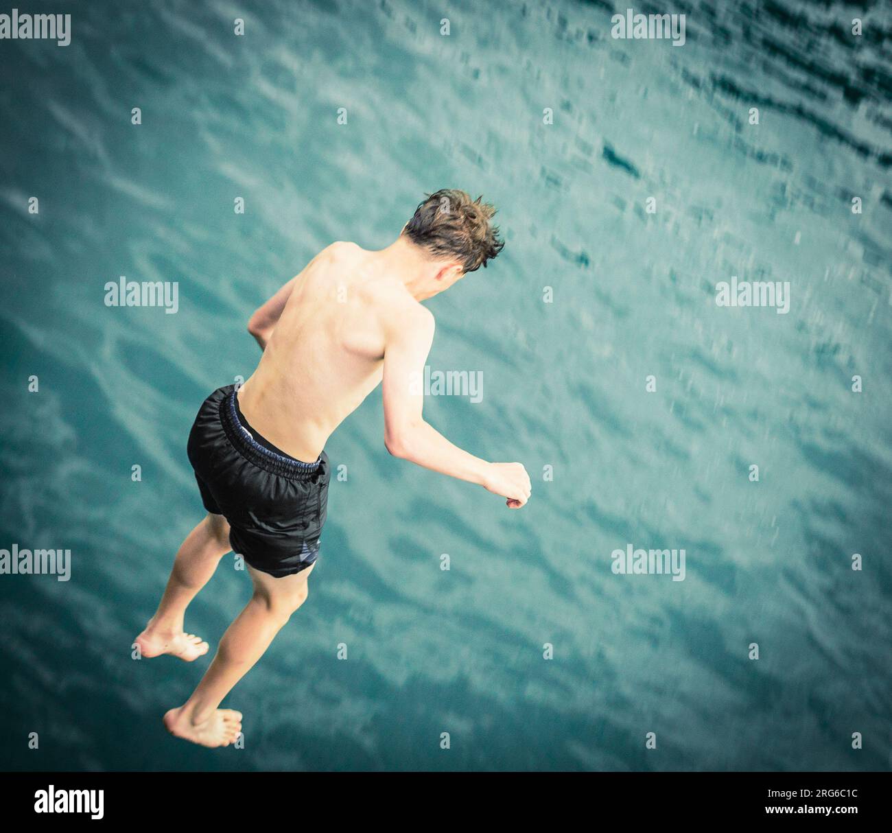 teenager teen boy water jumping Stock Photo - Alamy