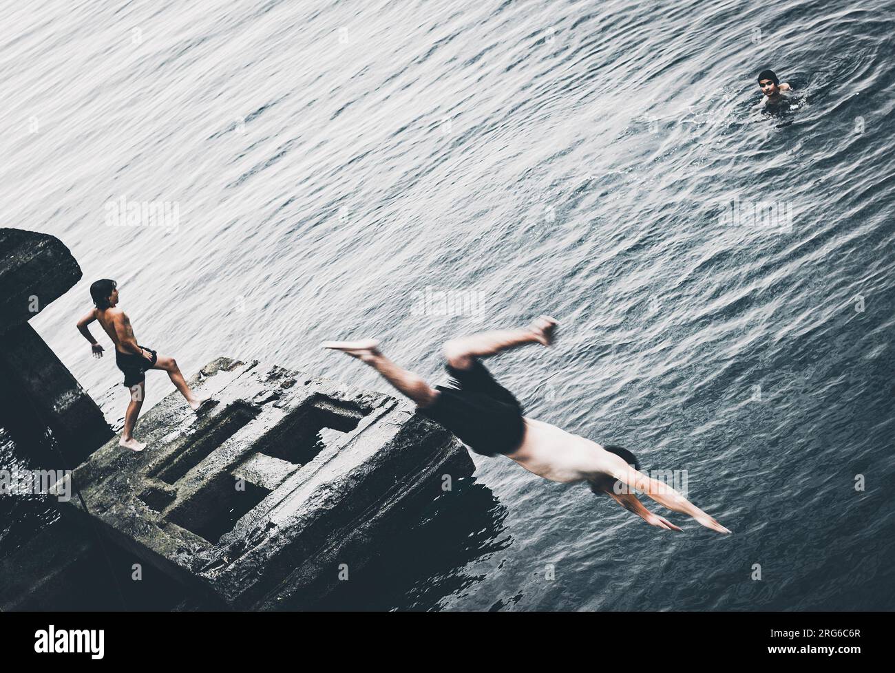 teenagers teen boy water jumping Stock Photo - Alamy