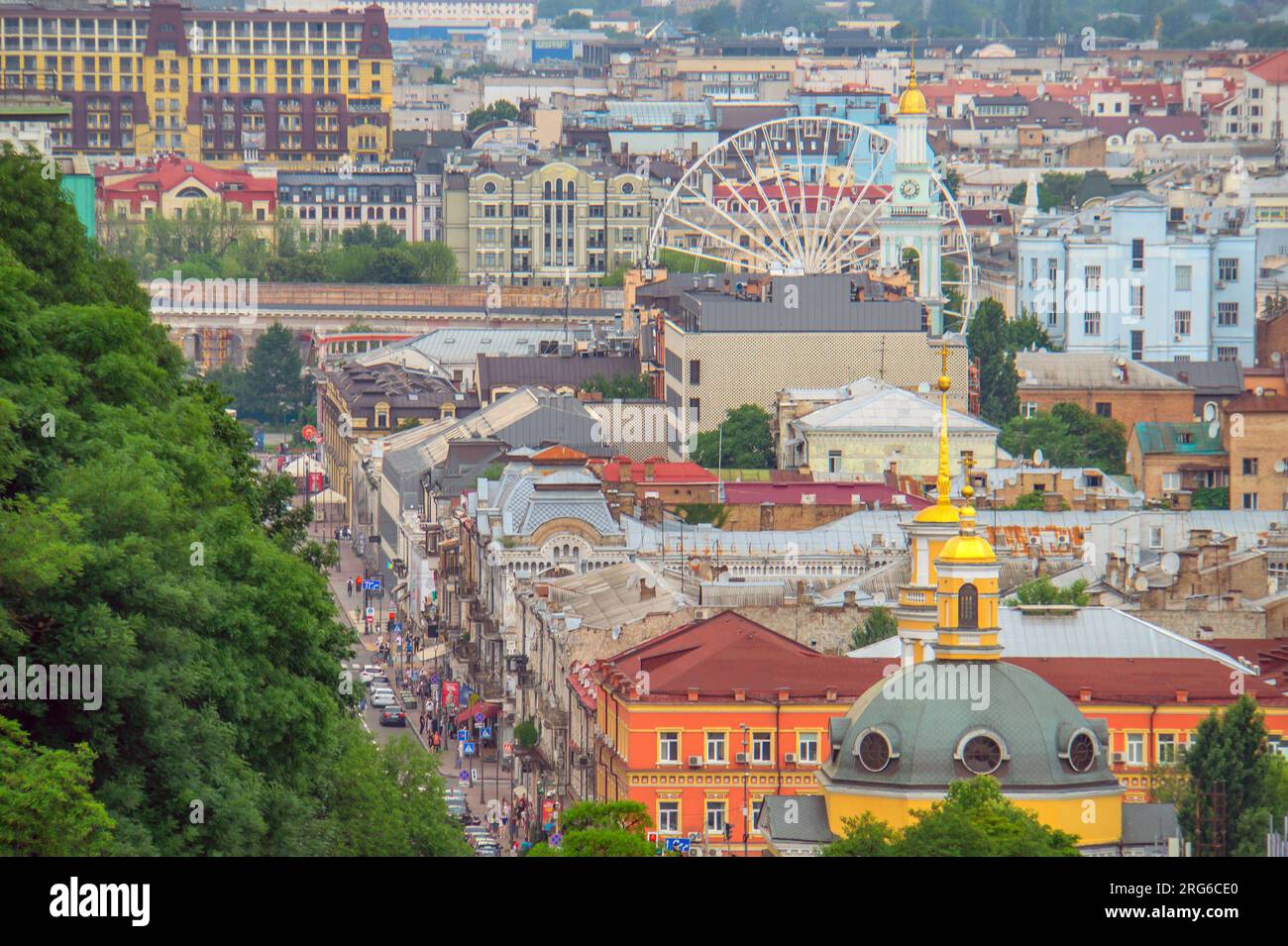 Colored roofs of the city with a wheel. Beautiful aerial view of ...