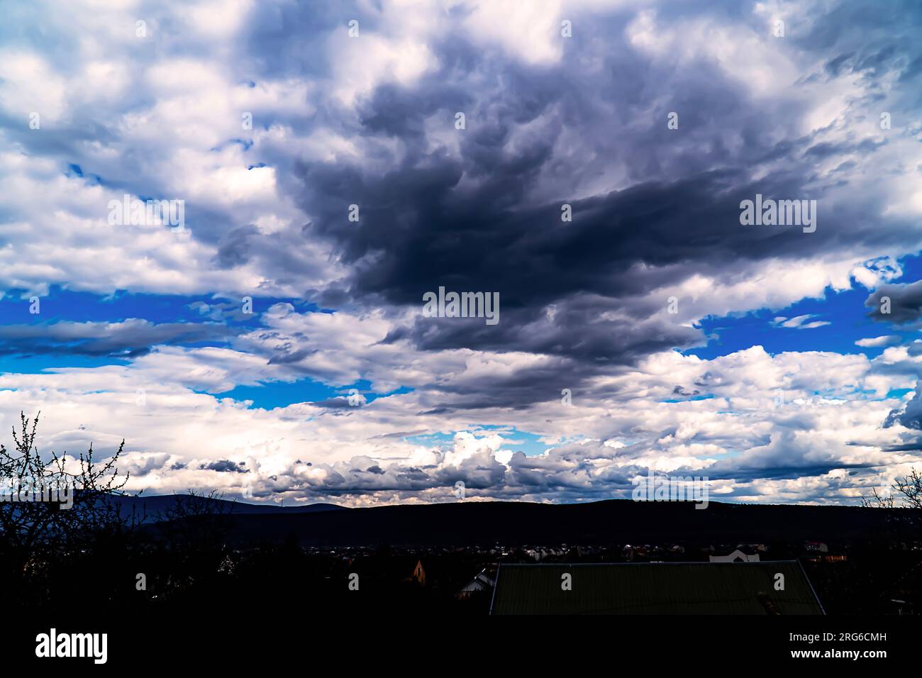 Beautiful cloud formations in the sky with tree branches, sky with ...