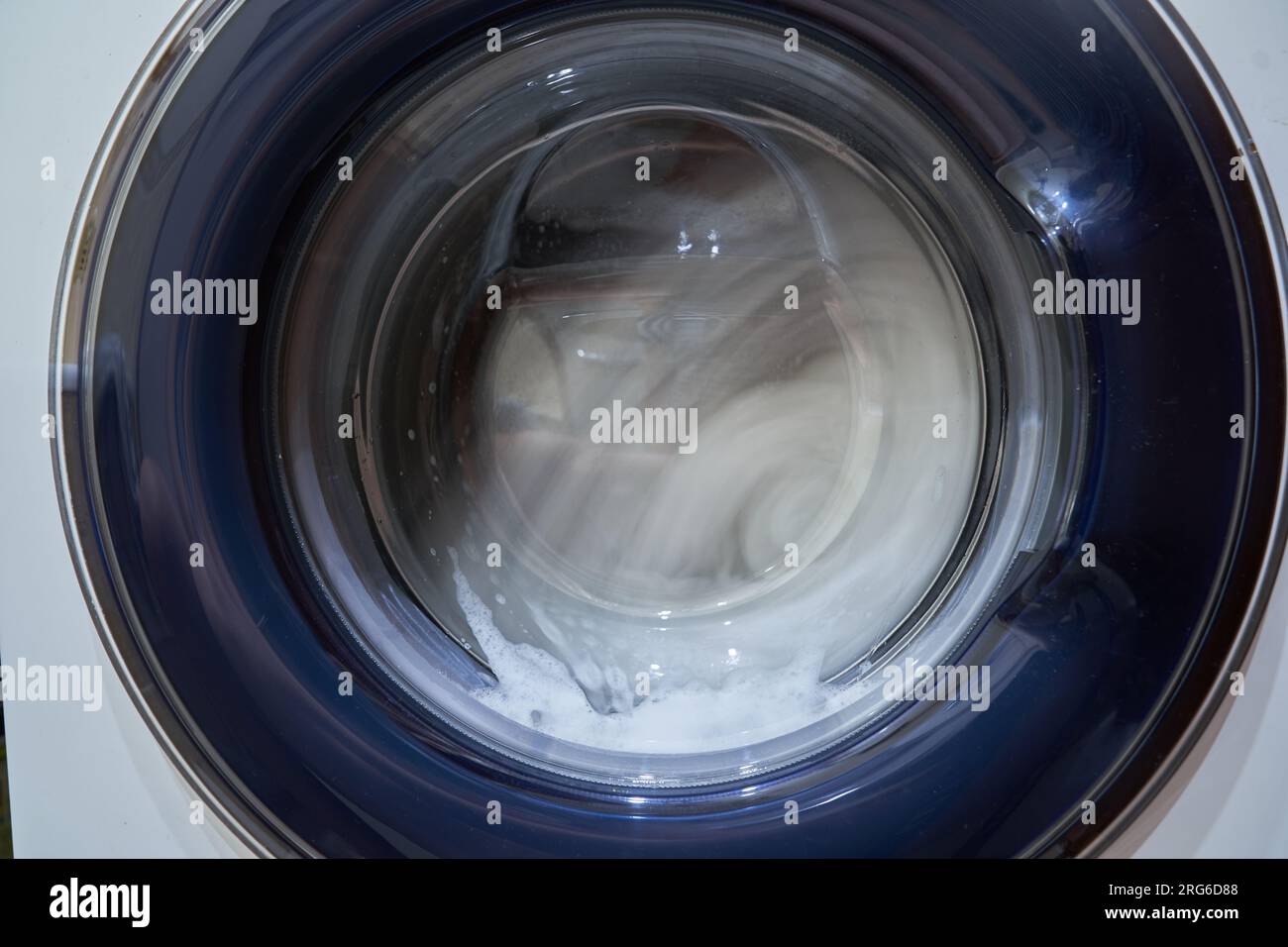 Drum washing machine rotates clothes hi-res stock photography and ...