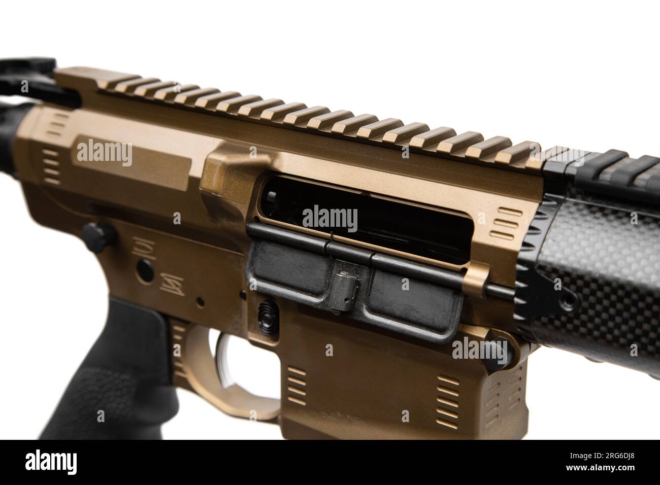 Modern automatic rifle isolated on white background. A gold-coloured ...