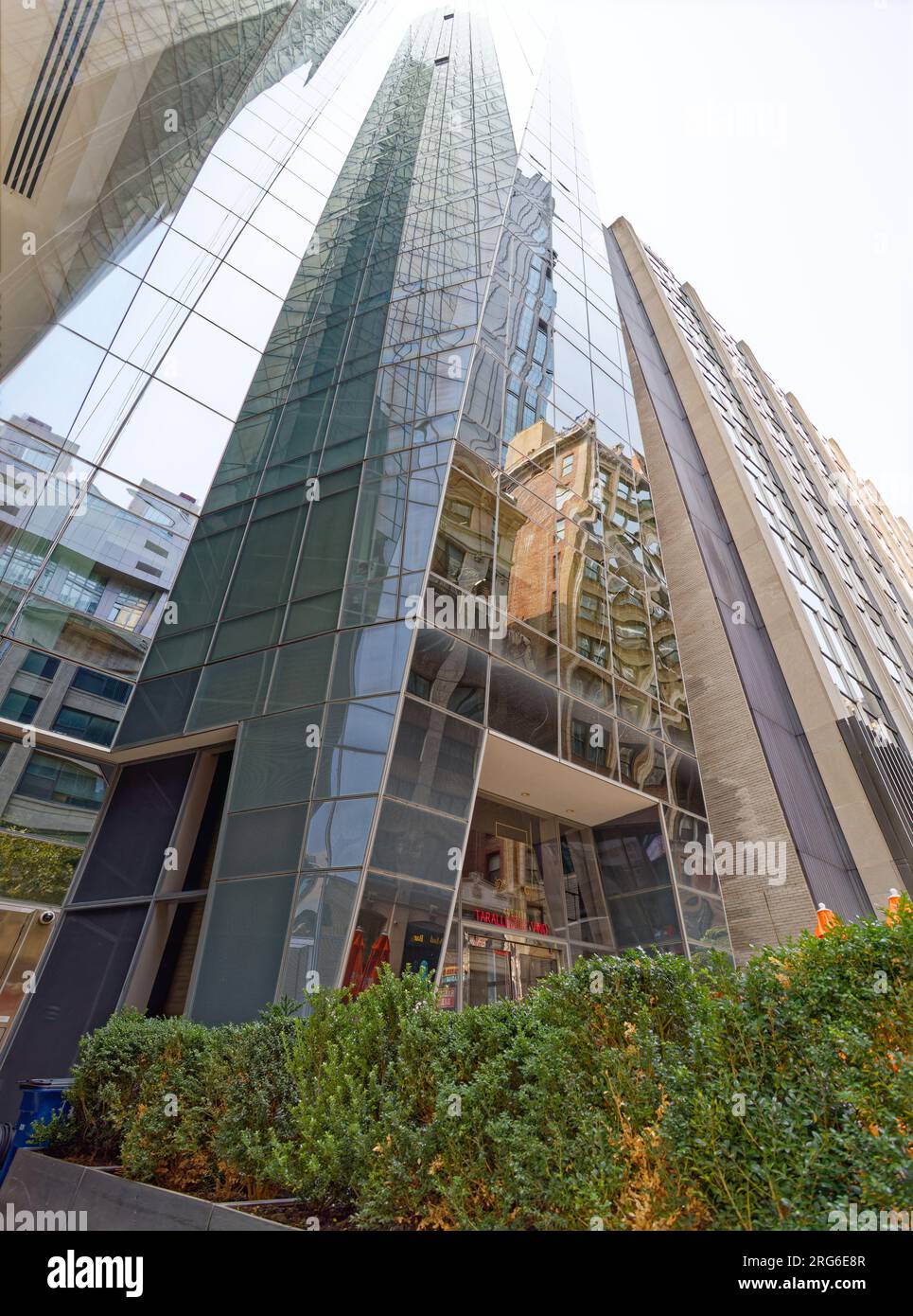 Glass-skinned Prism Tower contrasts with – and reflects – its brick-and ...