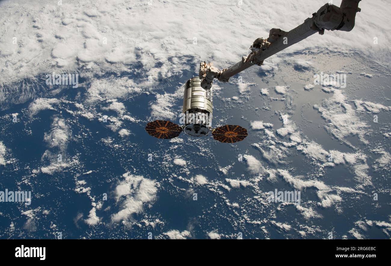 The Canadarm2 robotic arm reaches out to capture the Cygnus cargo ...