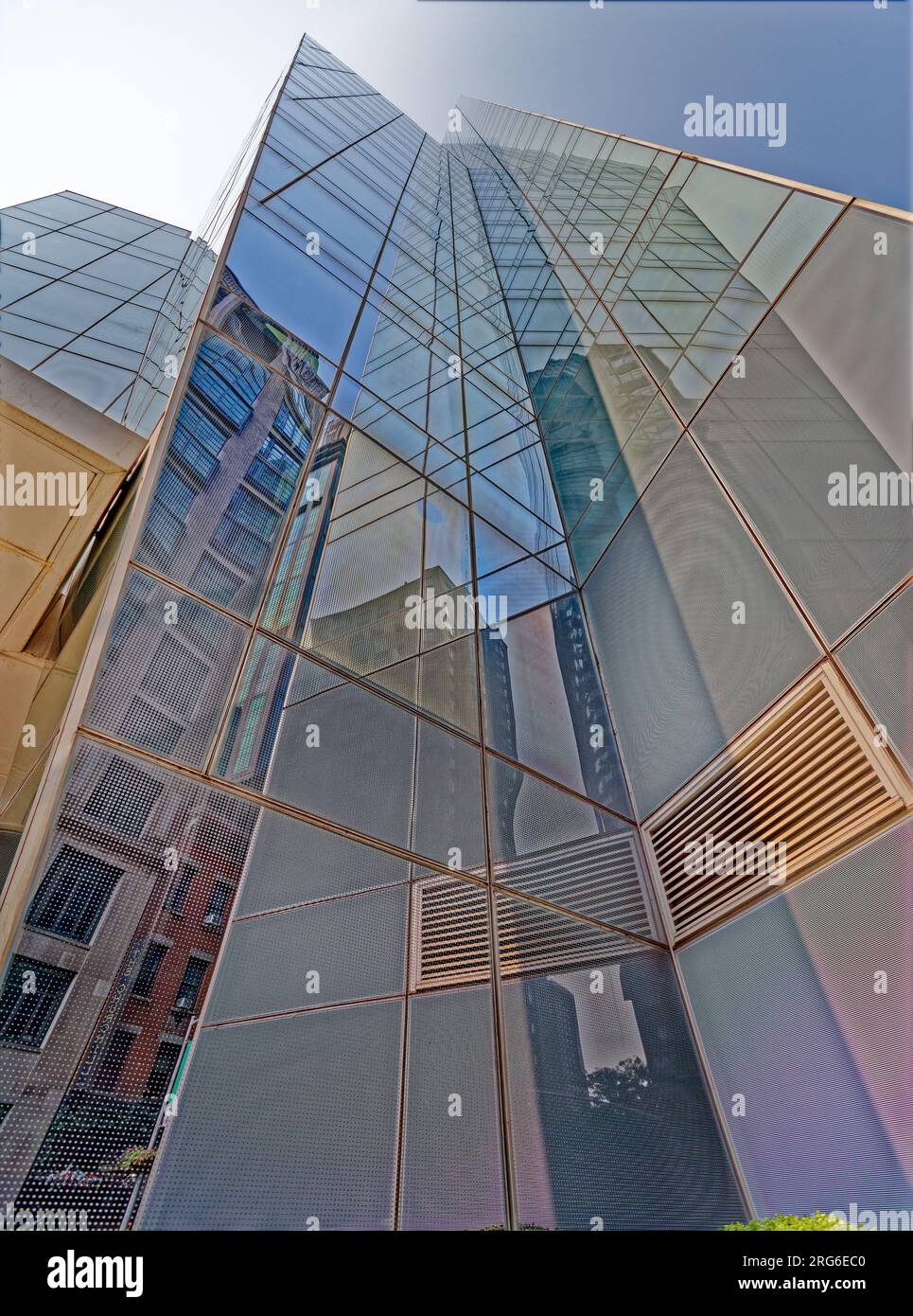 Glass-skinned Prism Tower contrasts with – and reflects – its brick-and ...