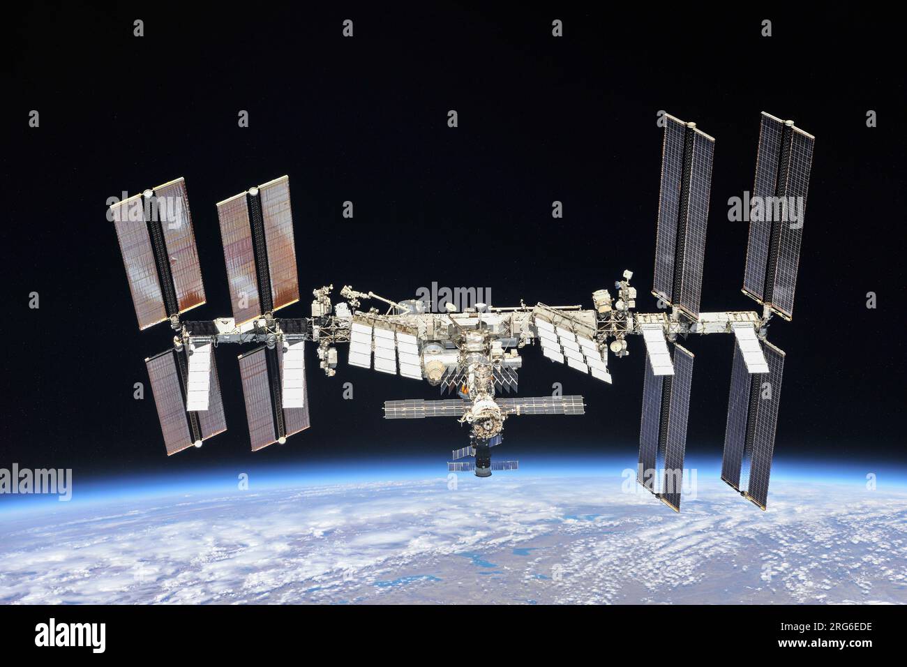 The International Space Station orbiting above Earth Stock Photo - Alamy