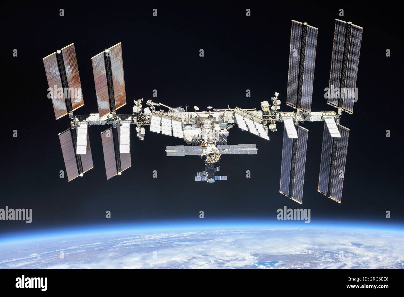 The International Space Station orbiting above Earth Stock Photo - Alamy