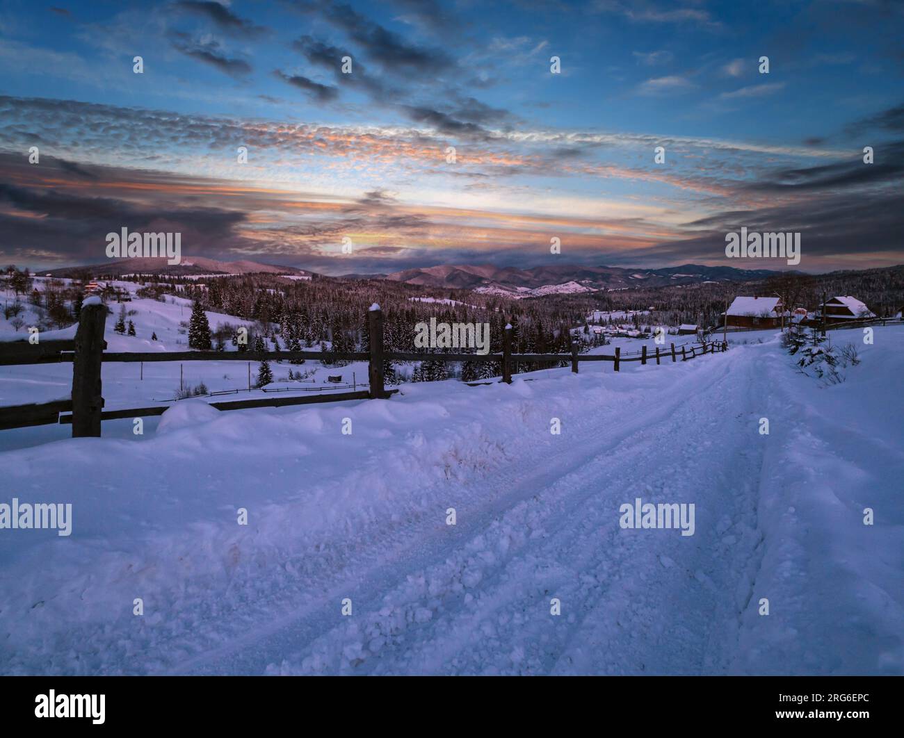 Night countryside road, hoases, hills, groves and farmlands in winter ...