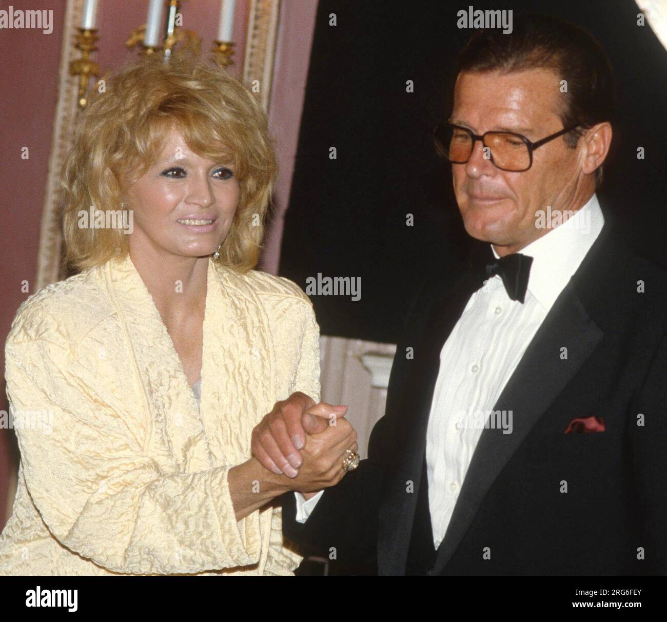 1986 Angie Dickinson Roger Moore John Barrett/PHOTOlink. Photo via ...