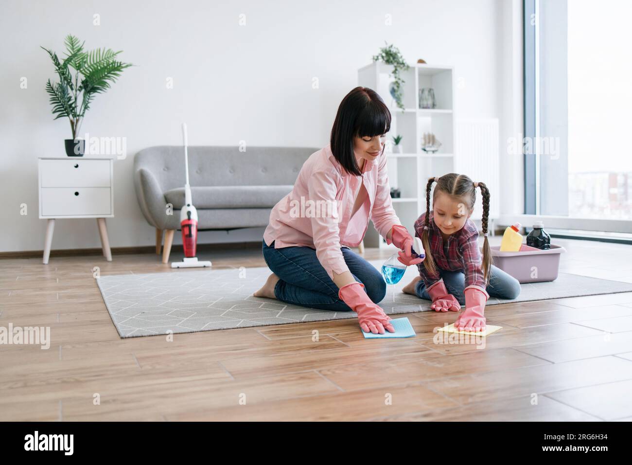 Cleaning together mother vacuuming hi-res stock photography and images ...