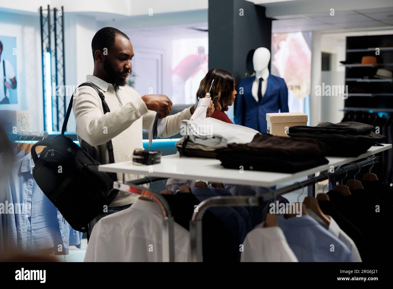 African american customer checking tie hi-res stock photography and ...