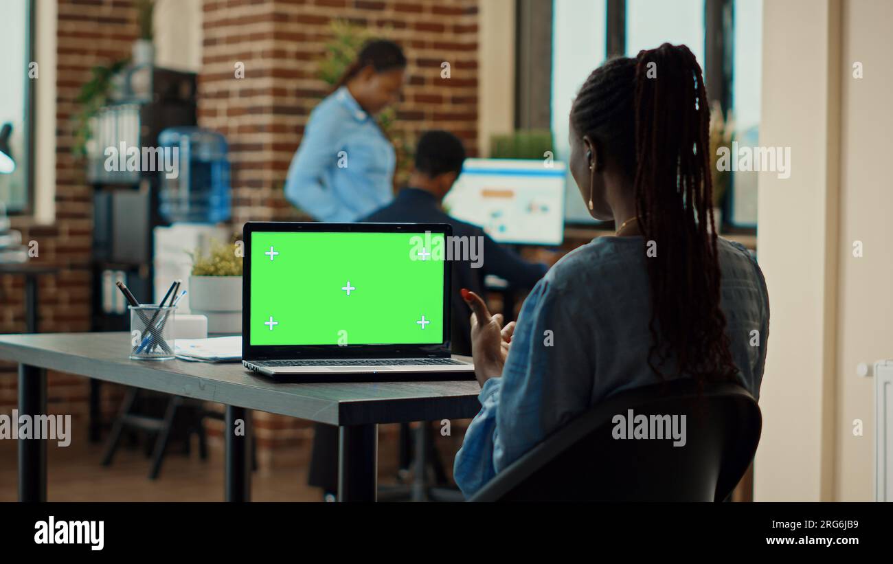 Corporate person using green screen in office, checking business ...