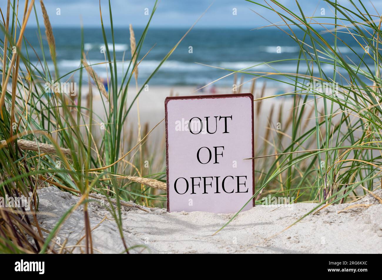 The slogan 'out of office' in the sand dunes at the beach Stock Photo ...