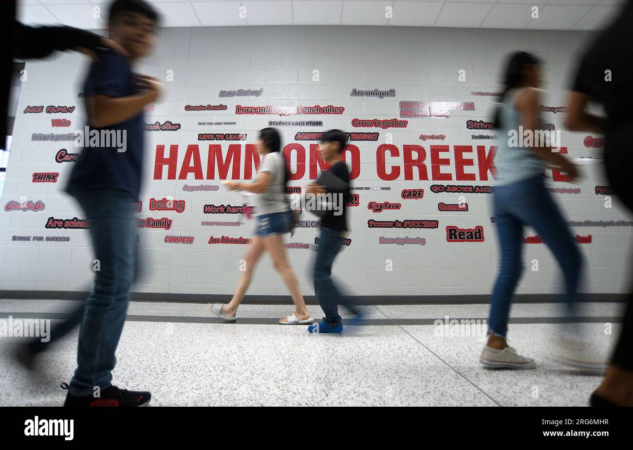 Students and parents explore the halls during sixth-grade orientation ...