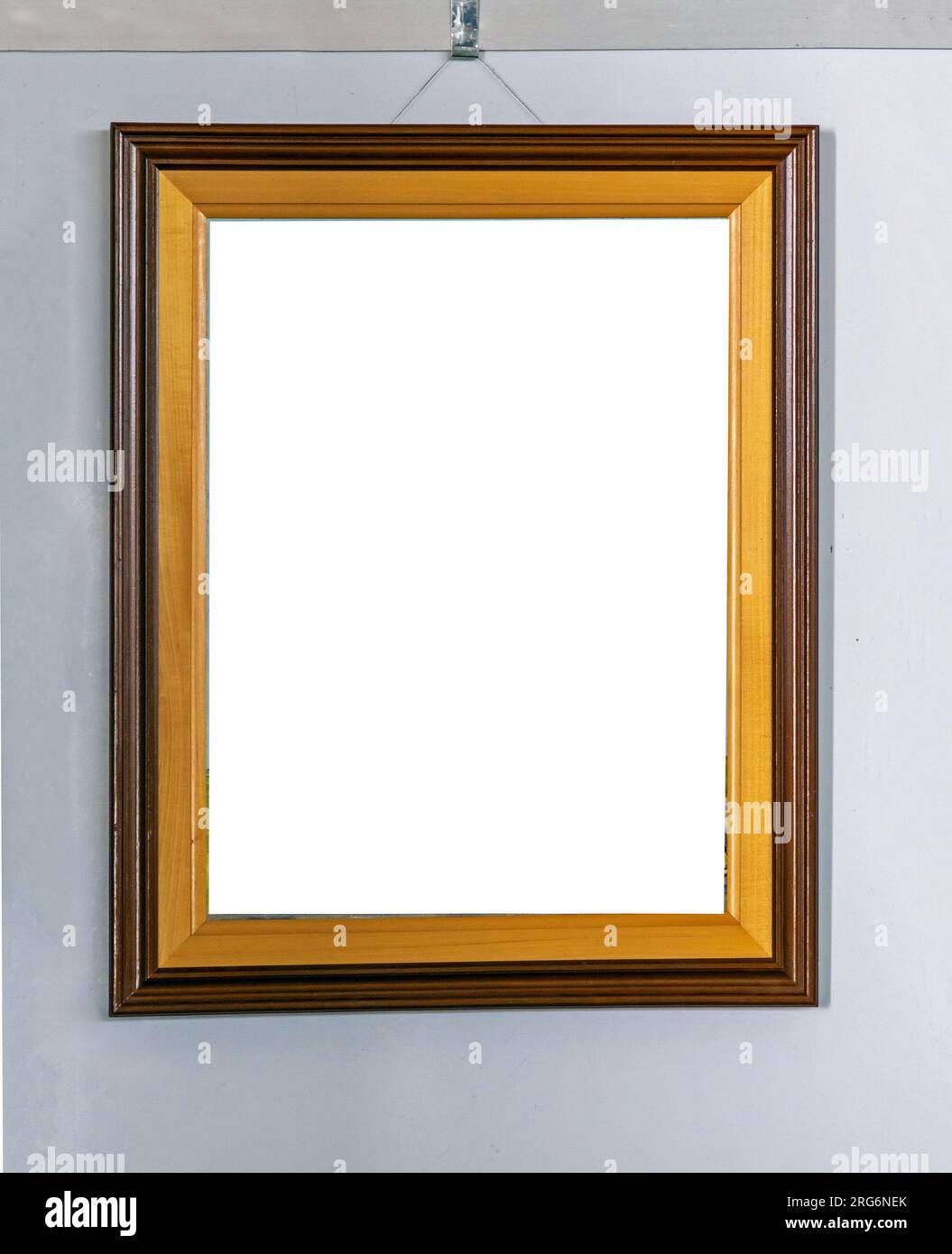 Retro old wooden empty frame hanging on a wall interior Stock Photo - Alamy