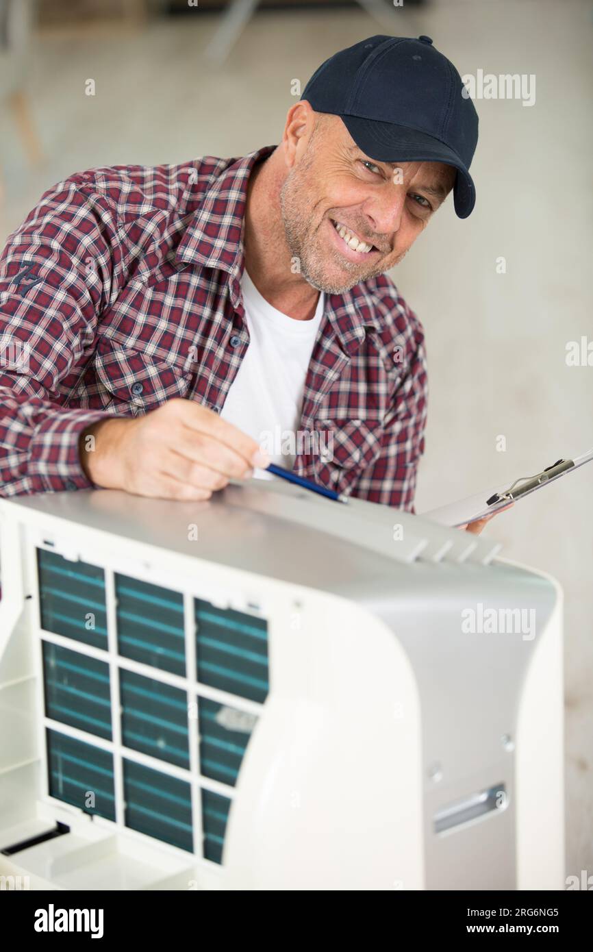 Electrician fixing electric stove hi-res stock photography and images ...
