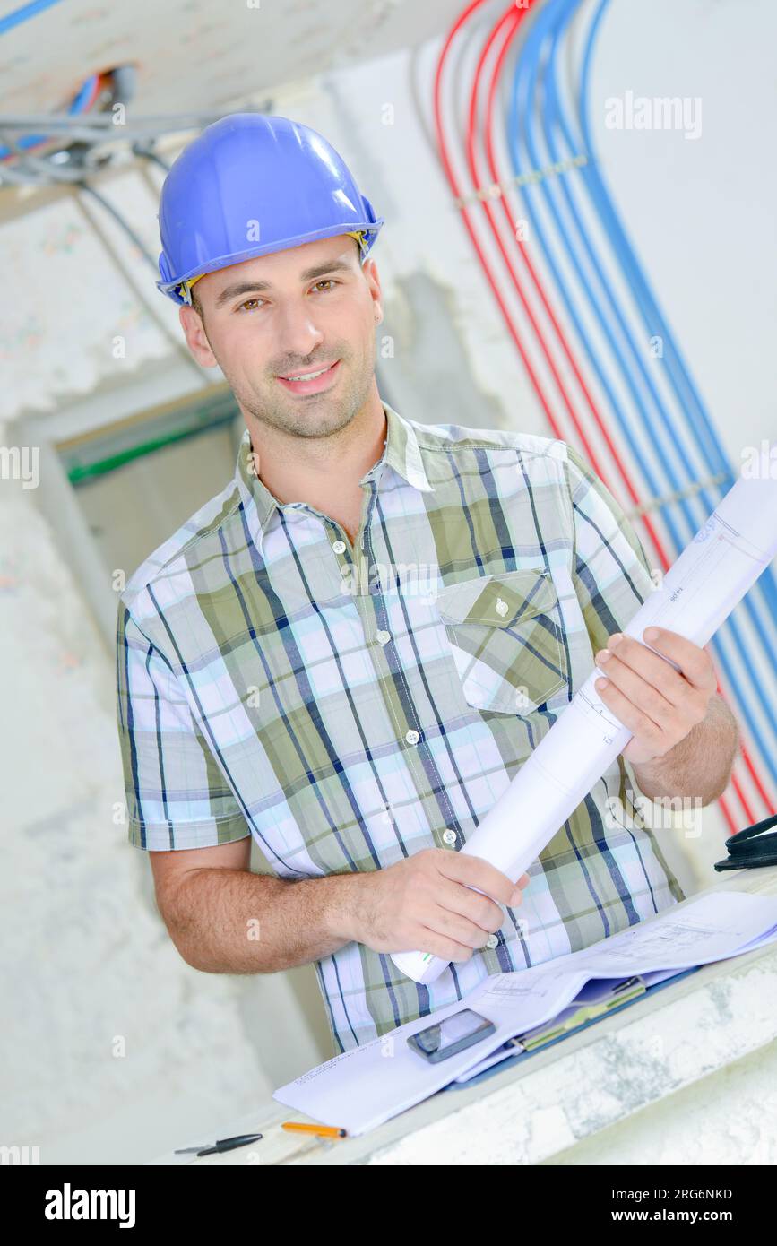 Rolled up construction plans hi-res stock photography and images - Alamy