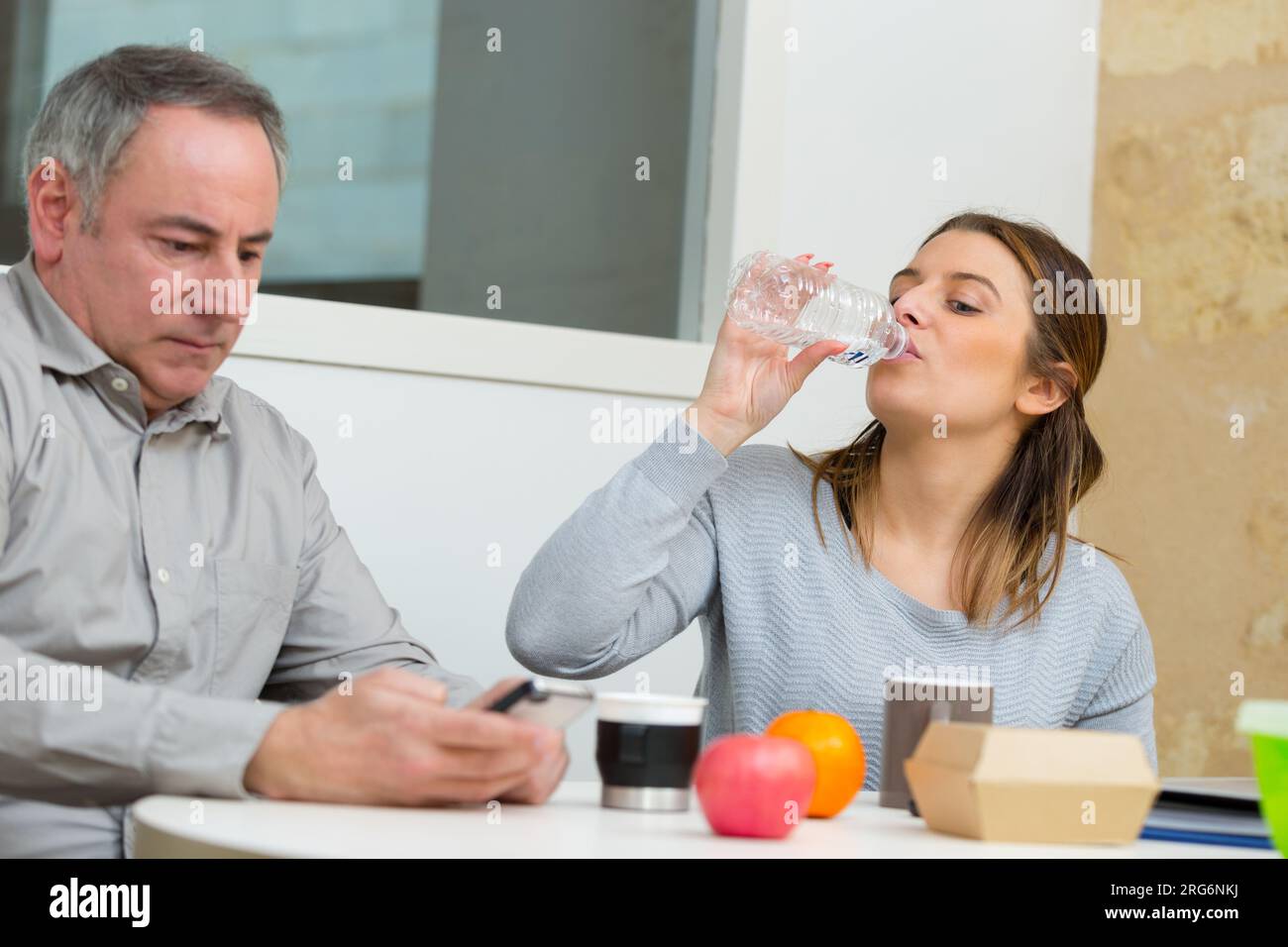 serious man with colleague during lunch break Stock Photo - Alamy