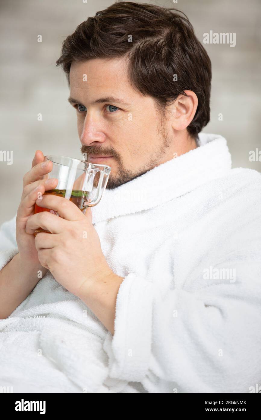 Handsome man drinking tea hi-res stock photography and images - Alamy