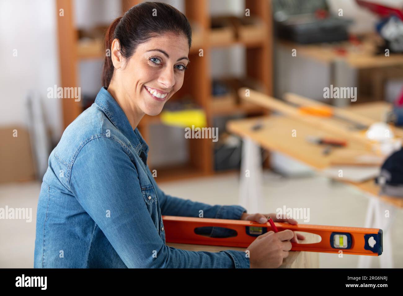 Female builder using spirit hi-res stock photography and images - Alamy