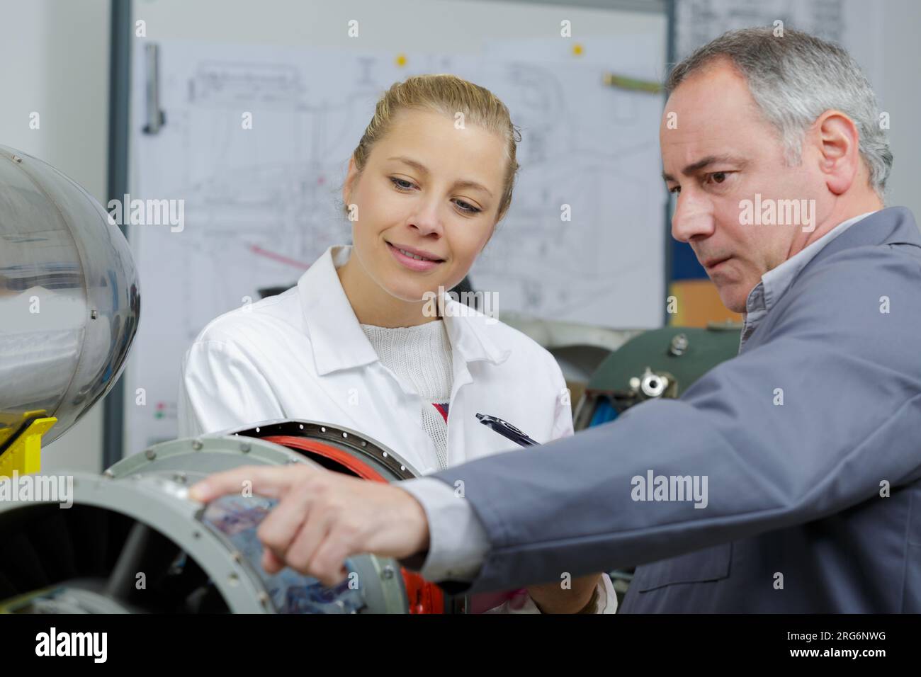 female apprentice being trained in aerospace workshop Stock Photo - Alamy