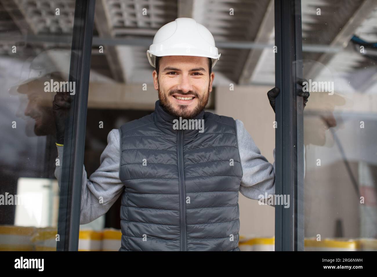 construction worker installing new window in house Stock Photo - Alamy
