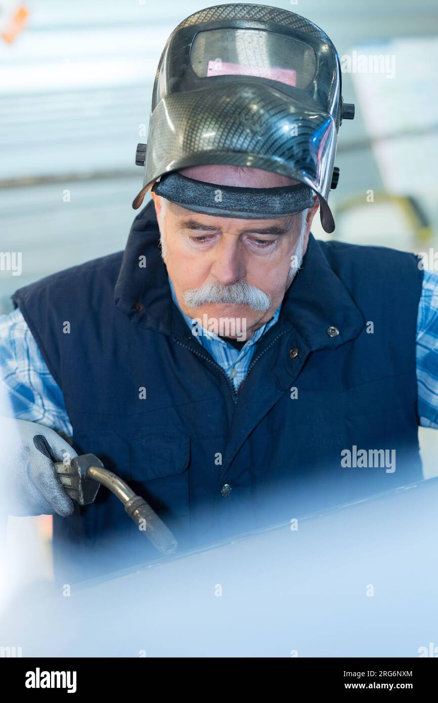 portrait factory senior welder worker Stock Photo - Alamy