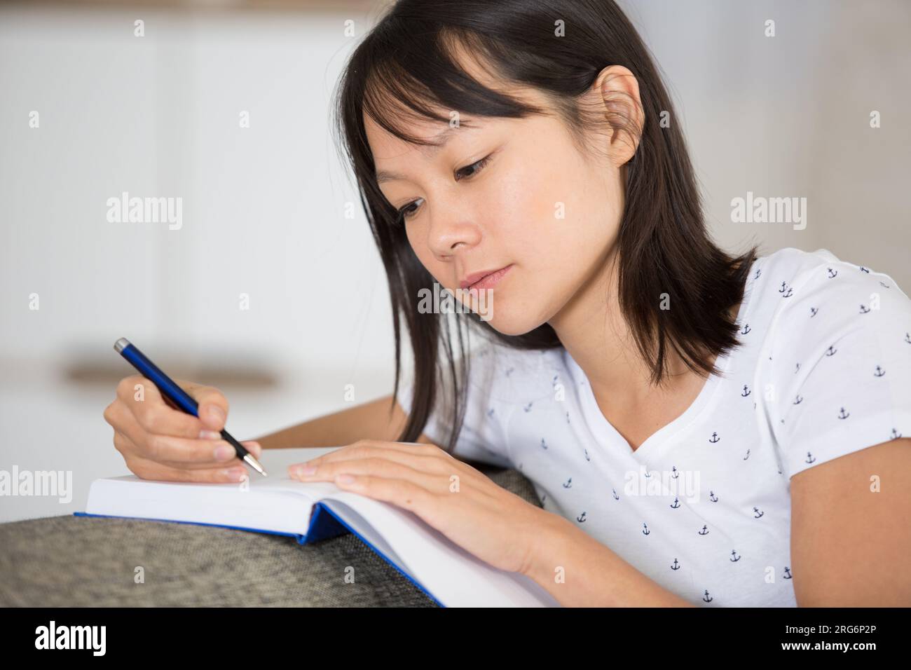 Woman handwriting in living hi-res stock photography and images - Alamy