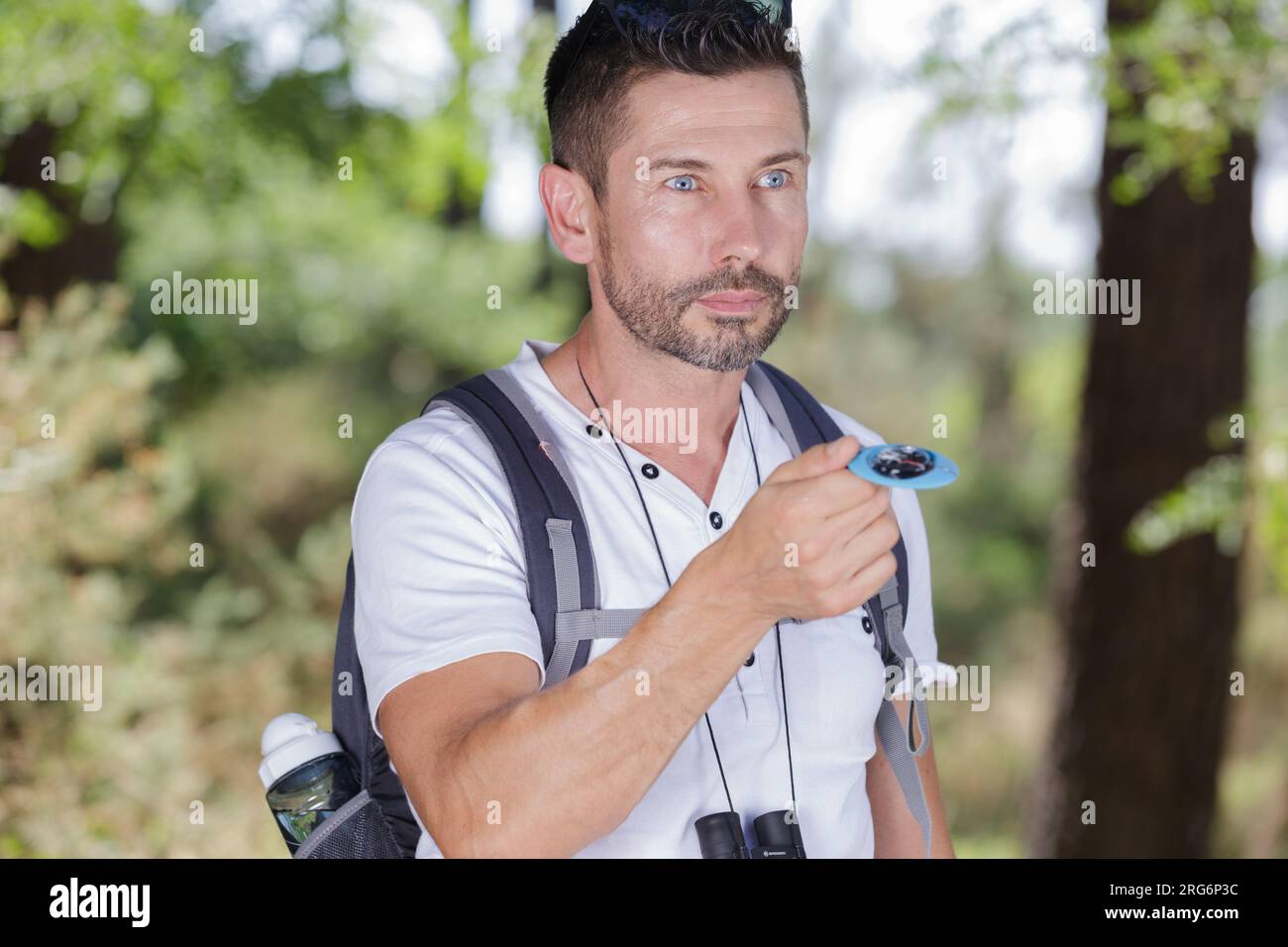 hiker with a compass in the mountains Stock Photo - Alamy