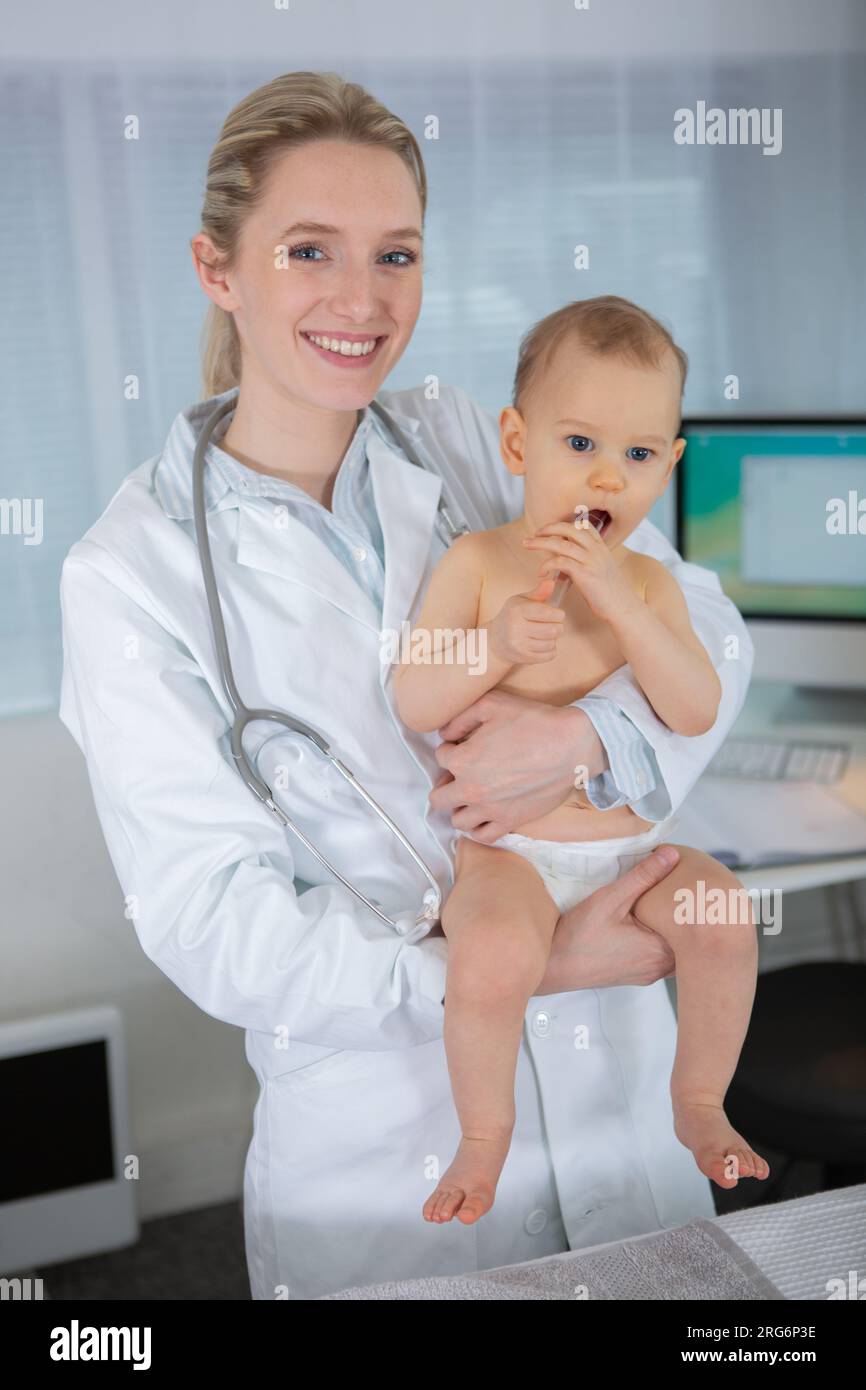 Happy doctor pediatrician baby hi-res stock photography and images - Alamy