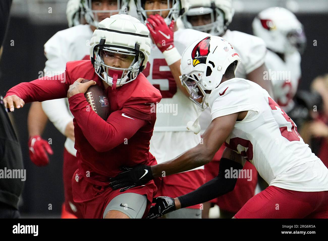 Arizona Cardinals running back James Conner, left, runs with the ball ...
