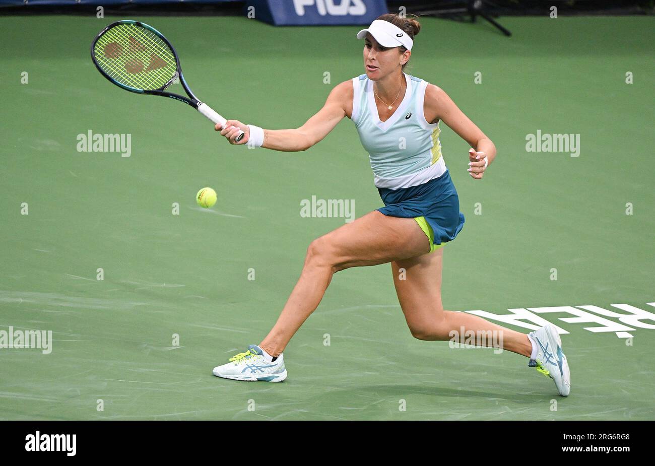 Belinda Bencic, of Switzerland, plays a shot to Lucia Bronzetti, of ...