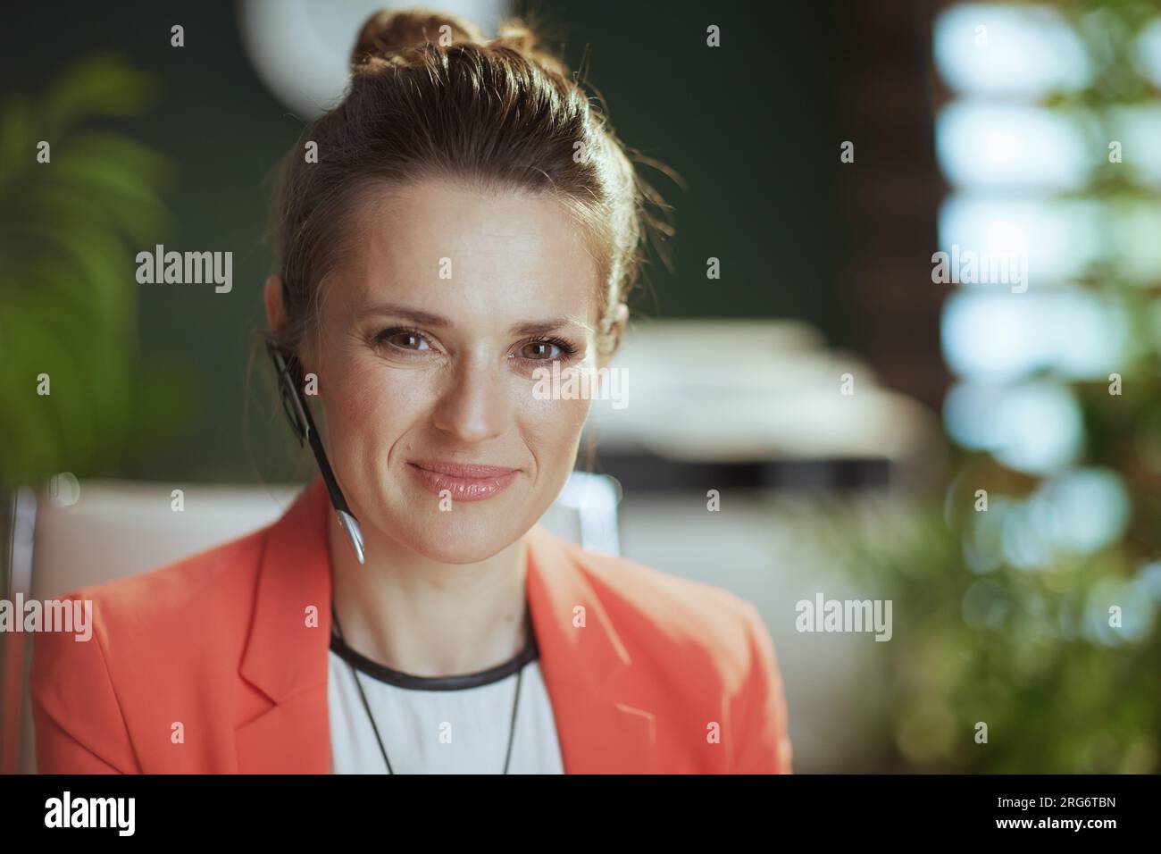 Sustainable workplace. Portrait of modern business woman at work in a ...