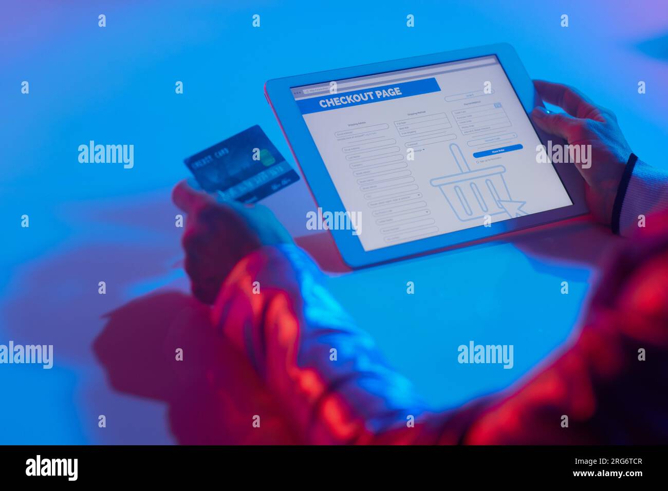 Seen from behind modern woman with credit card using digital tablet and ...