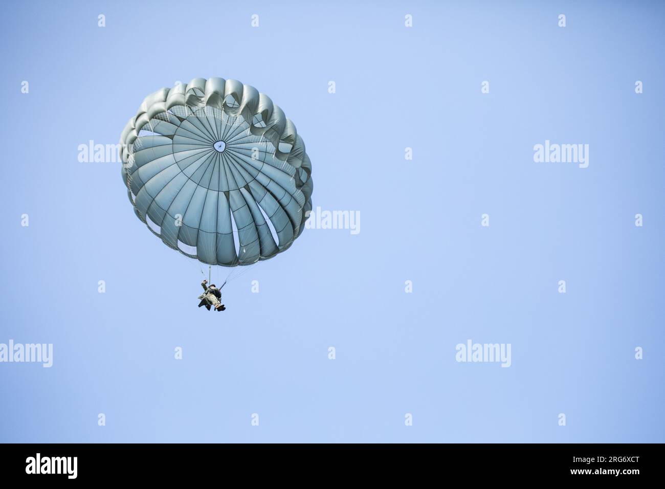 A U.S. Army Paratrooper descends onto Glen Rock Drop Zone from a Ch-47 ...