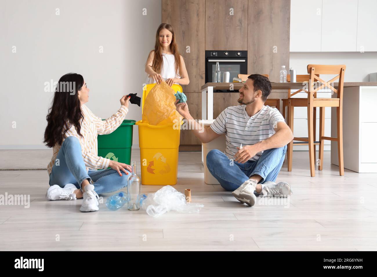 Mother daughter sorting recycling waste kitchen hi-res stock ...