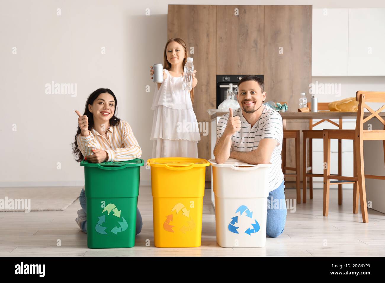 Mother daughter sorting recycling waste kitchen hi-res stock ...