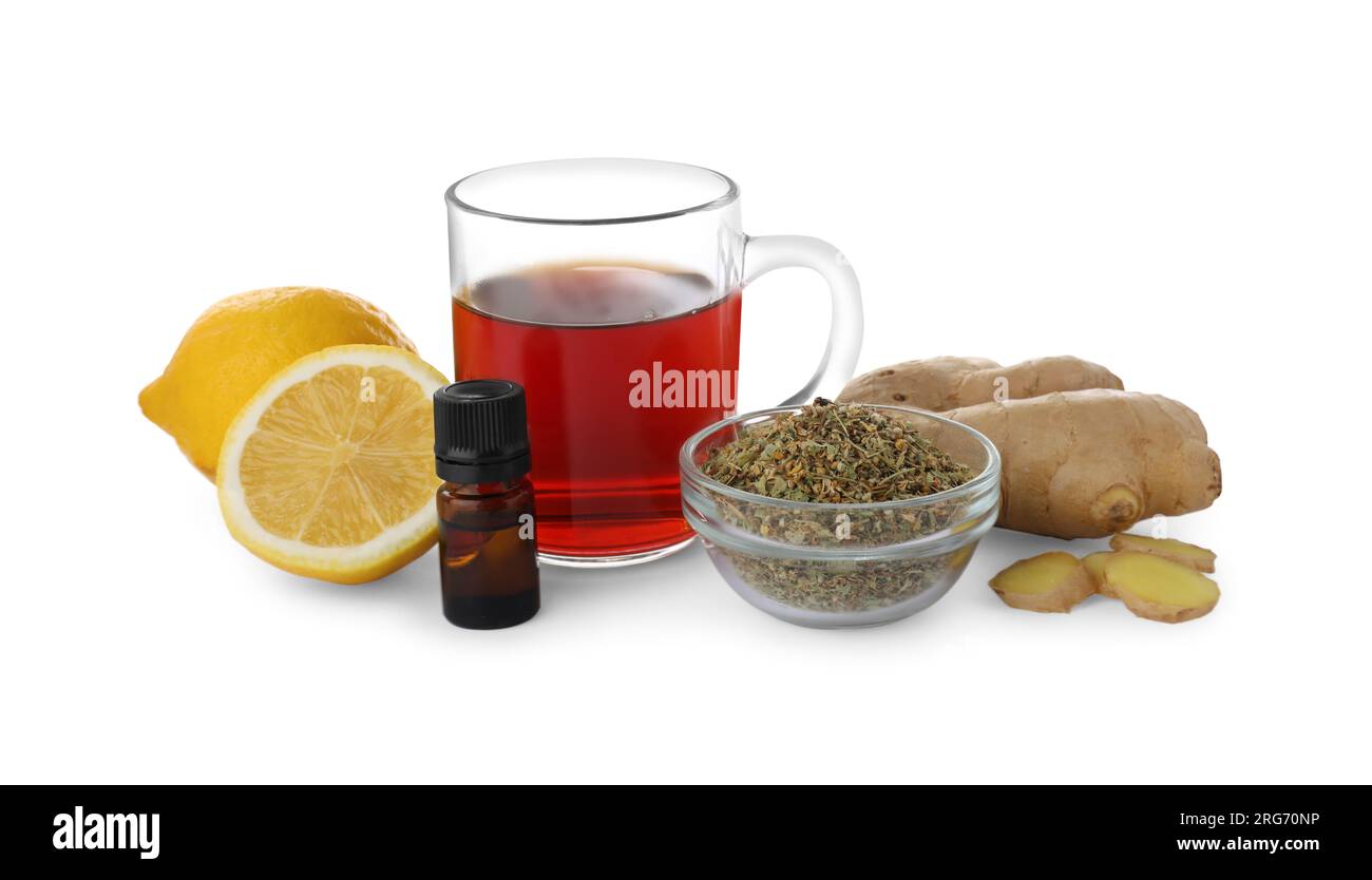 Cup of tea and different natural cold remedies on white background ...
