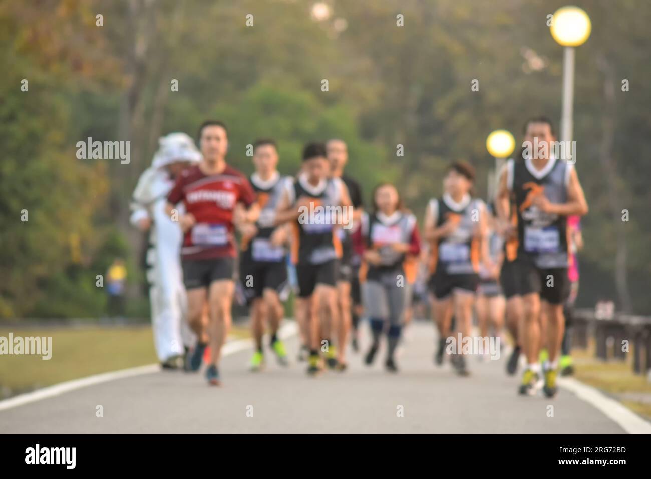 Blurred Group of people running in a marathon Stock Photo - Alamy