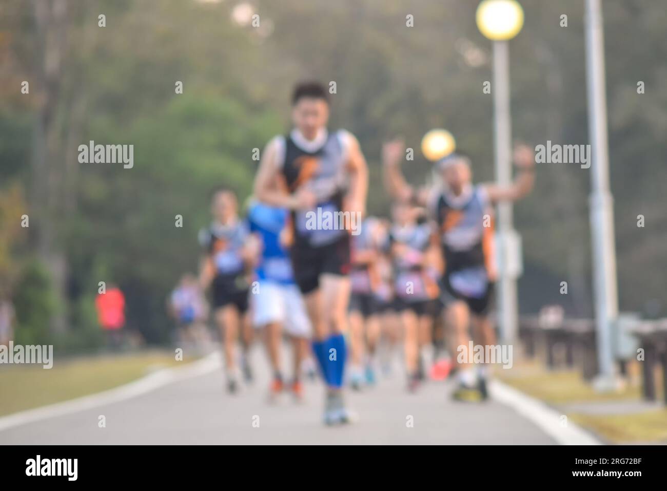 Blurred Group of people running in a marathon Stock Photo - Alamy