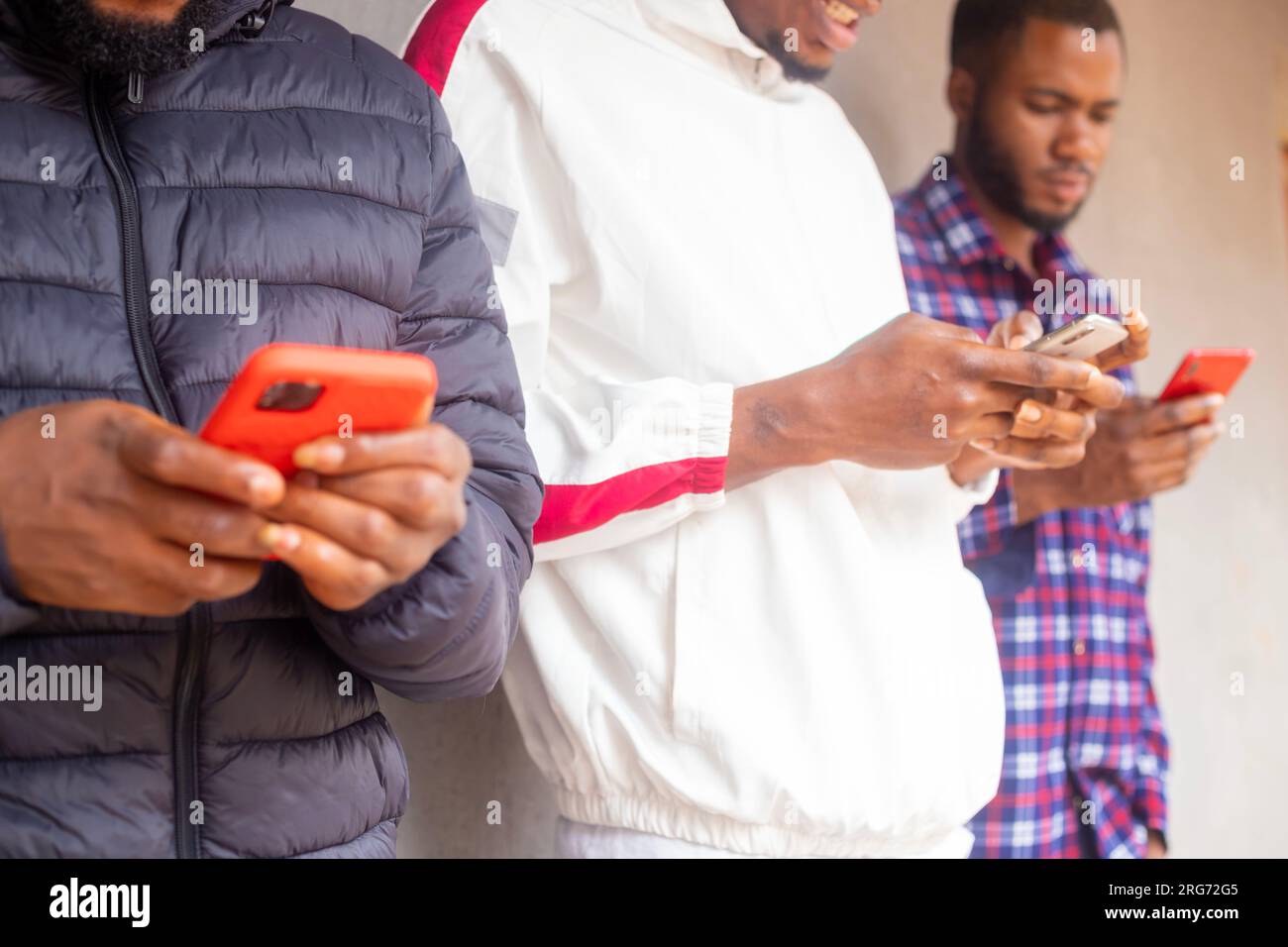 Group of multicultural friends using smartphone outdoors - People hands ...