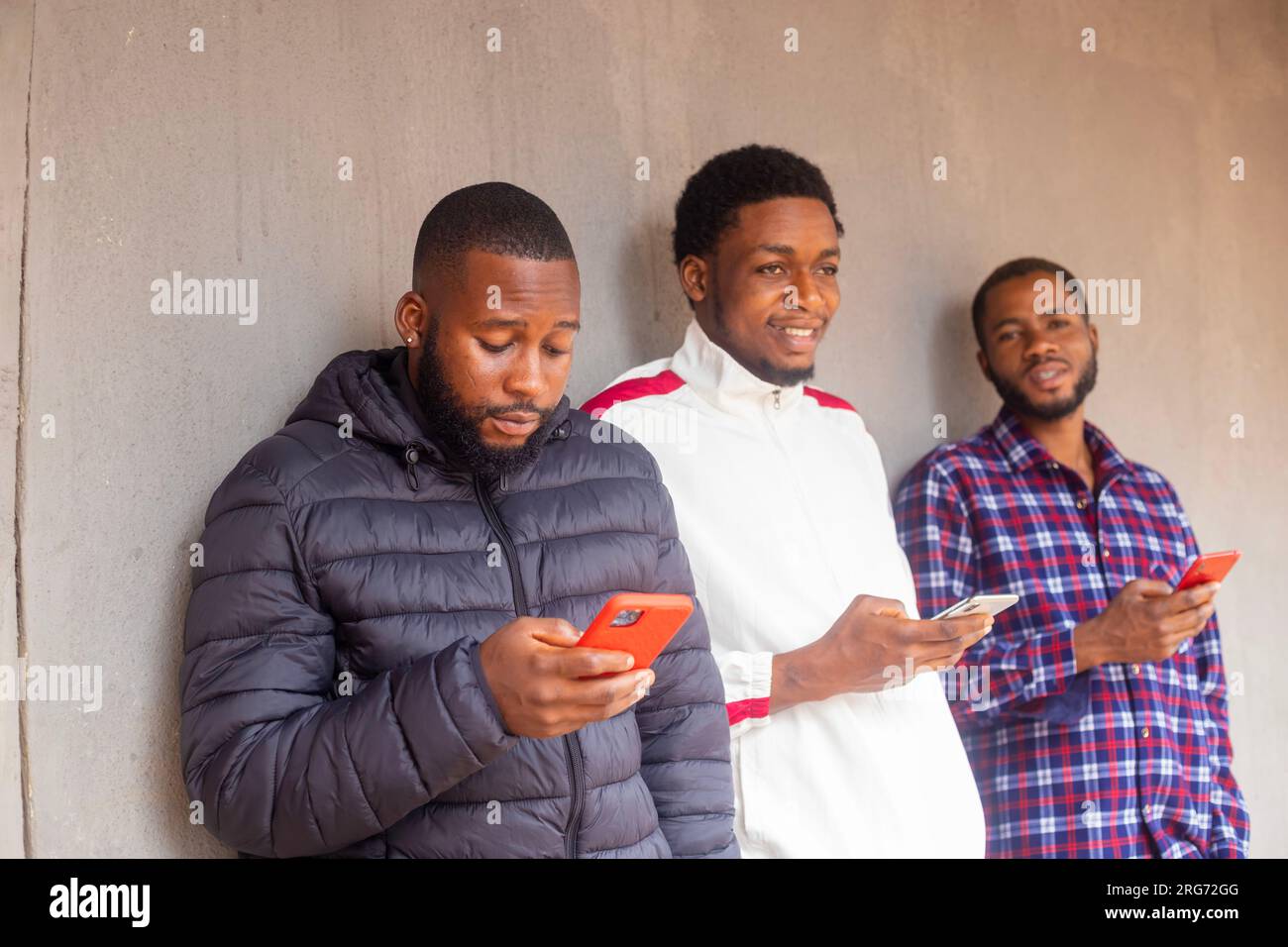 Group of multicultural friends using smartphone outdoors - People hands ...