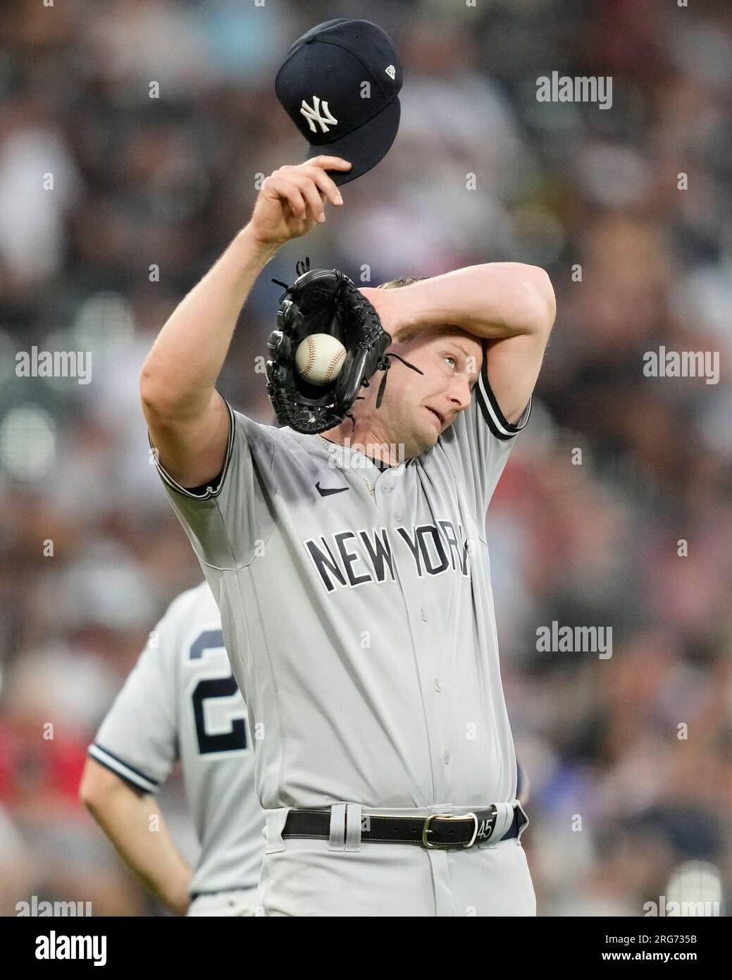New York Yankees starting pitcher Gerrit Cole wipes his head after a ...