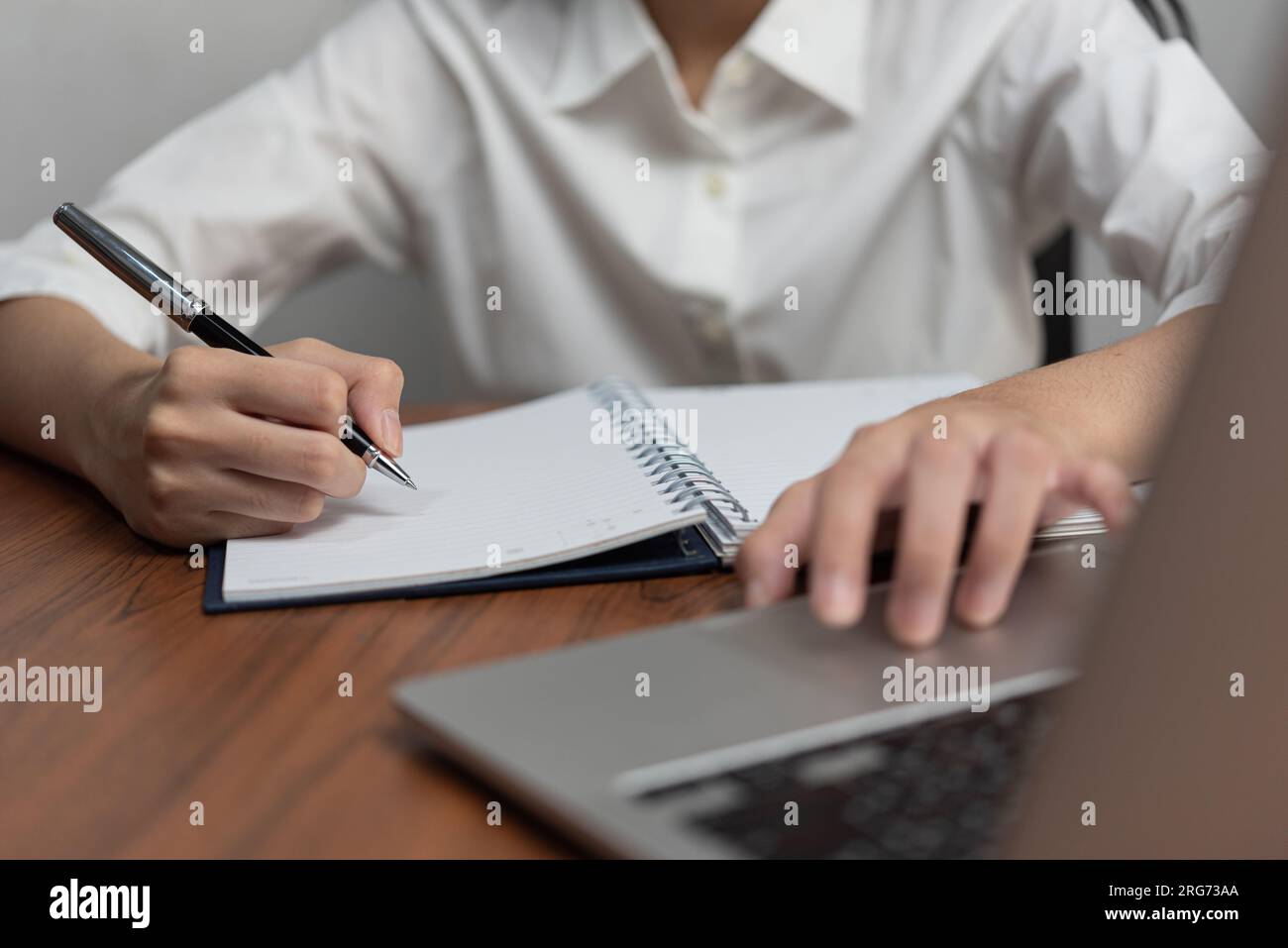 Businessperson reading and writing on book.education studying knowledge ...